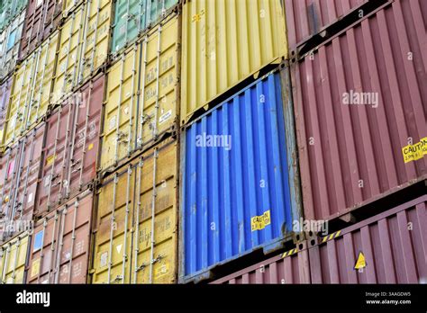 Standard Shipping Container In A Container Terminal In Front Of Loading Onto A Container Ship