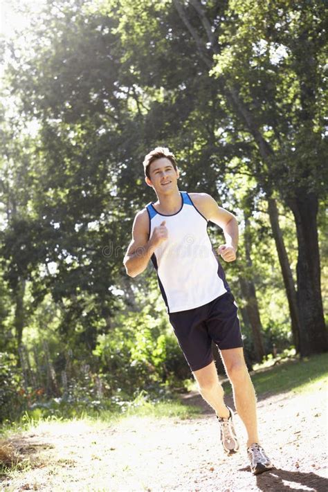 Young Man Running Along Woodland Path Stock Image Image Of Running Space 54932989