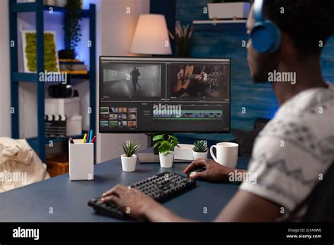 Professional Videographer Man Working Remote From Home At Montage Film Editing Visual Effects