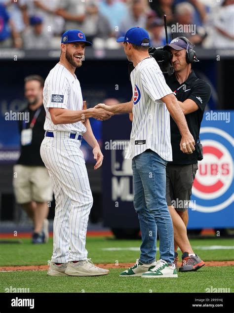England Cricketer James Anderson Right Shakes Hands With Chicago Cubs Patrick Wisdom Before