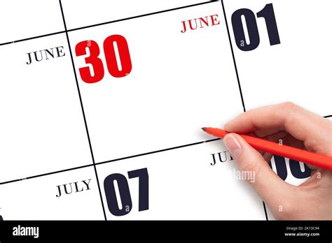 Th Day Of June A Hand Holding A Red Pen And Pointing On The Calendar Date June Red