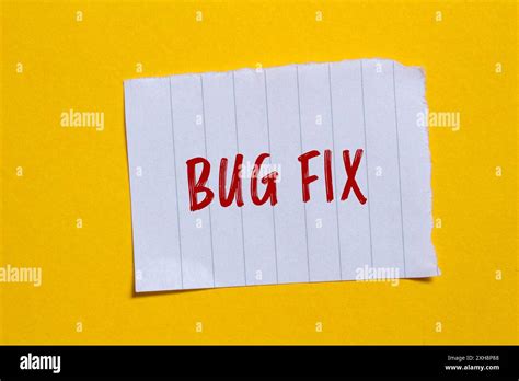 Bug Fix Message Written On Ripped Torn White Paper Piece With Yellow Background Conceptual Bug