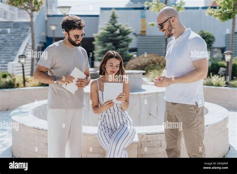A Team Of Architects Designers And Engineers Collaborating On A City Construction Project