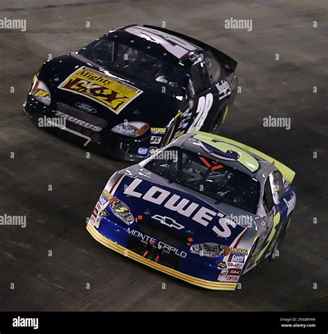 Kyle Busch 5 Leads Derrike Cope 28 Through A Turn During The Nascar