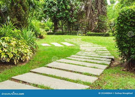 Garden Landscape Design With Pathway Intersecting Bright Green Lawns