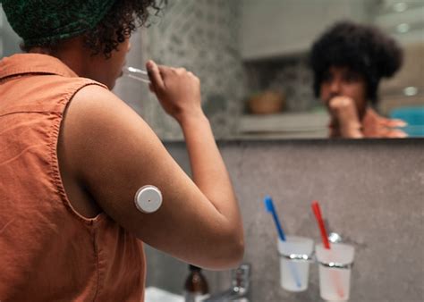 Free Photo Diabetic Man Checking Glucose Patch Sensor