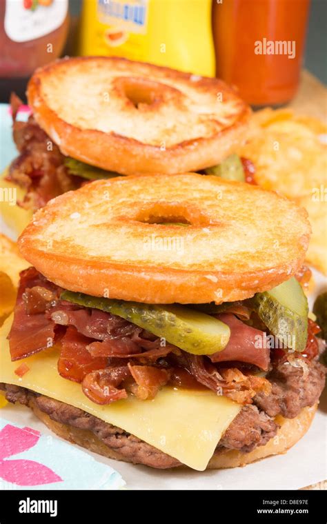 The Luther Burger A Beef Patty Cheese Crispy Bacon And Gherkins Between Two Halves Of A
