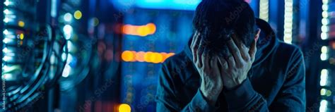 Stressed Professional In Server Room A Man Visibly Stressed