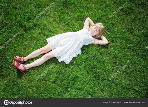 Woman Laying In Grass