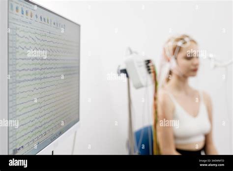 Female Patient Undergoing An Eeg Test Showcasing Modern Healthcare And Patient Comfort Perfect