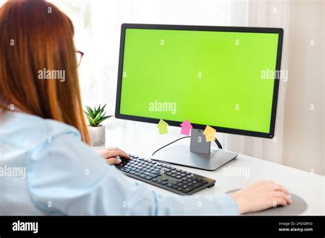 Close Up Of Female Hands And PC With Green Chromakey Blank Screen Mock Up Of Computer Monitor