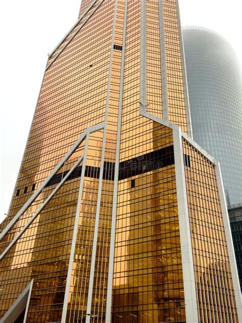 A Tall Building With A Gold Facade And A Glass Window Stock Image Image Of Modern Financial