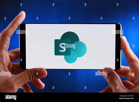 Poznan Pol Feb 19 2020 Hands Holding Smartphone Displaying Logo Of