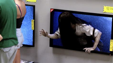Watch The Rings Girl Prank Customers By Crawling Out Of Televisions