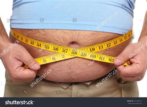 측정 테이프를 들고 있는 뚱뚱한 남자 스톡 사진 131784191 Shutterstock