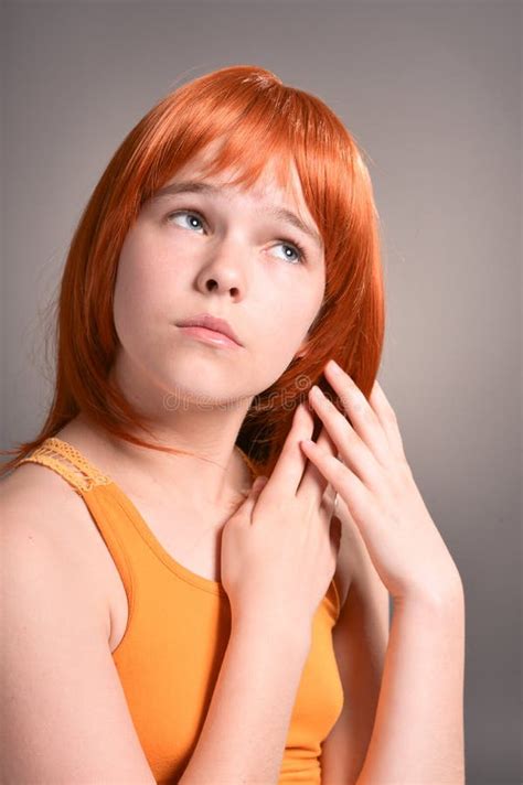 Portrait Of Beautiful Young Girl Posing In Studio On Background Stock