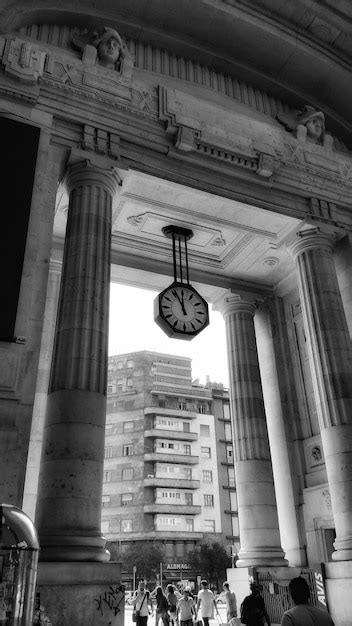 Premium Photo Old Fashioned Clock In Neo Classical Building Portico
