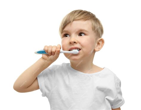 Premium Photo Cute Little Boy Brushing Teeth On White Background