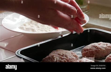 A Woman Makes Homemade Meatballs Or Cutlets From Minced Meat Dips Them In Flour Stock Video