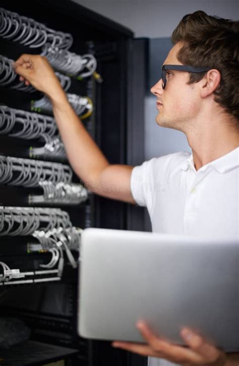Server Room Information Technology And Man With Laptop Check Connectivity And Night Job