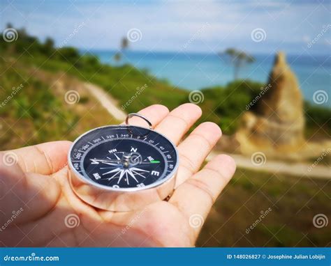 Holding On A Compass Showing Your Direction And Your Navigation By