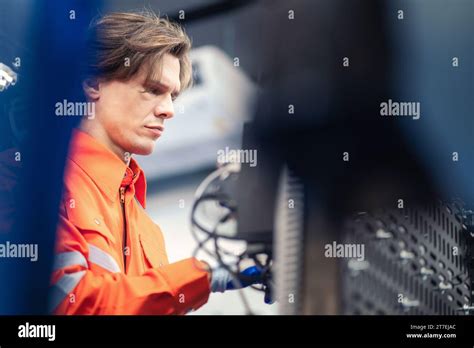 Electrical Engineer Checking Power Distribution Cabinet In The Control