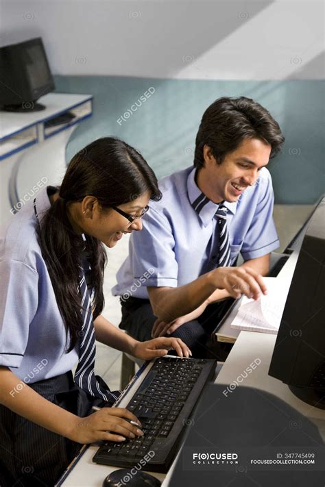 Babe And Girl In A Computer Lab Educational Institute Teenagers Stock Photo