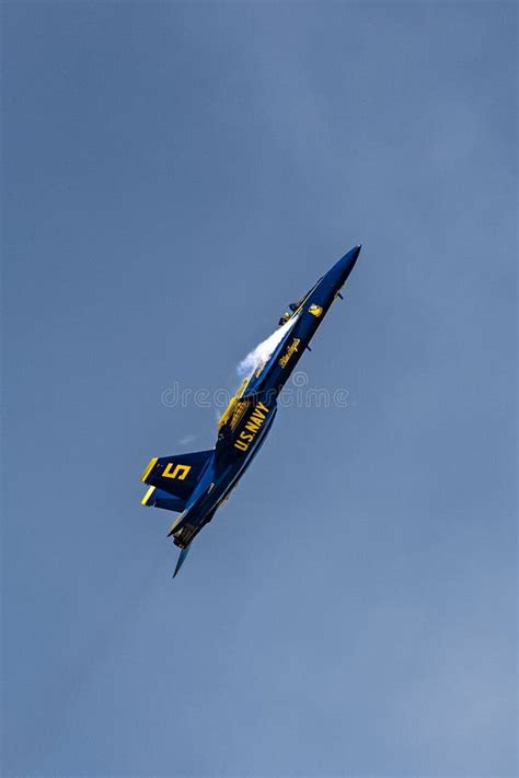 A Small Fighter Jet Flying Through The Blue Sky With Smoke Coming Out Editorial Photo Image Of