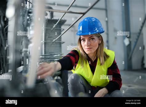 Portrait Of Female Engineer Working In Industrial Factory Doing