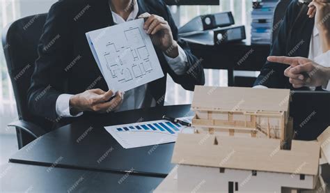 Premium Photo Close Up Of Business Team Analyzing Income Charts And Graphs With Modern Laptop