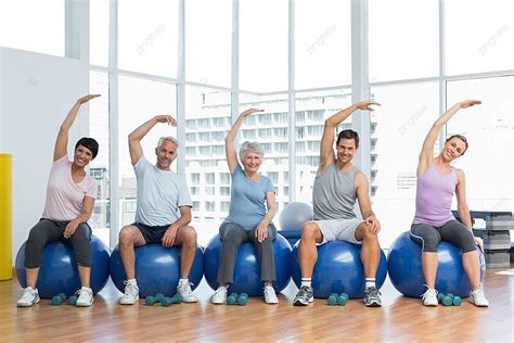 Gym Class Stretching And Sitting On Exercise Balls Photo Background And
