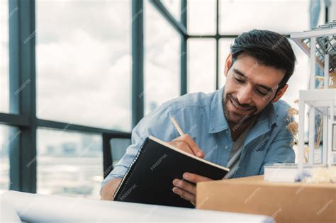 Premium Photo Smart Engineer Inspecting House Model Structure While Taking A Note Tracery
