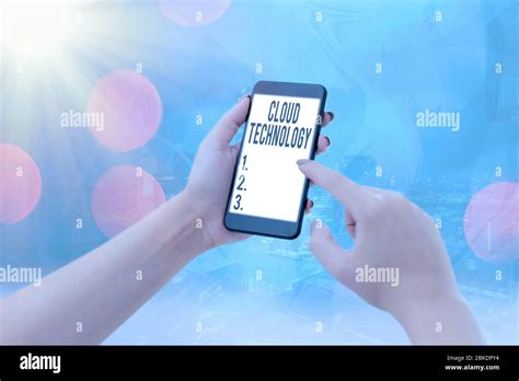 Conceptual Hand Writing Showing Cloud Technology Concept Meaning Storing And Accessing Data And