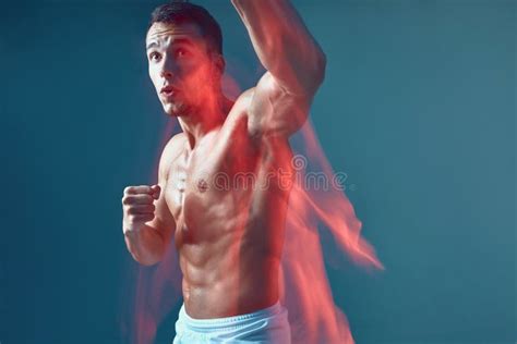 Strong Male Sportsman With Naked Body Doing Boxing Exercises Workout