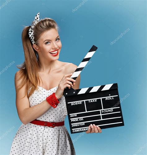 Sexy Pin Up Girl Holding A Clapper Board Filmmaking Or Film Production