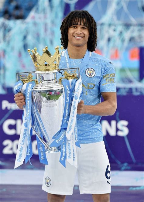 Download Manchester City Nathan Ake Holding Trophy Wallpaper