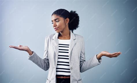 Premium Photo Decisions Choices And Options With A Young Business Woman Comparing And Weighing