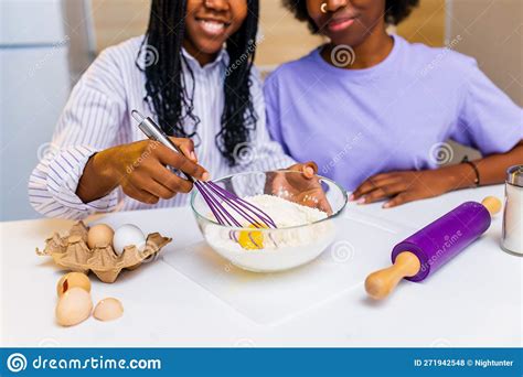 Happy Loving Same Sex Couple Is Preparing The Pastry In The Kitchen Stock Photo Image Of