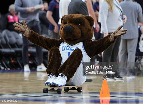 The Ucla Bruins Mascot Joe Bruin Rides A Skateboard During A Timeout