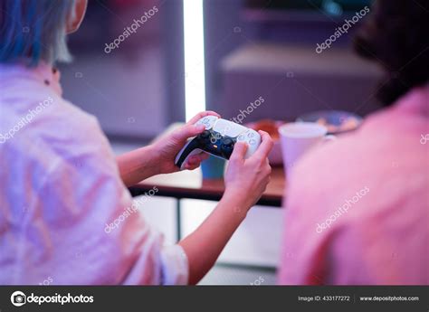 Girl Using New Sony Playstation DualSense Wireless Controller Which Offers Immersive Haptic