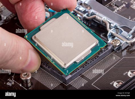 Installation Of Modern Processor In CPU Socket On The Motherboard Stock Photo Alamy