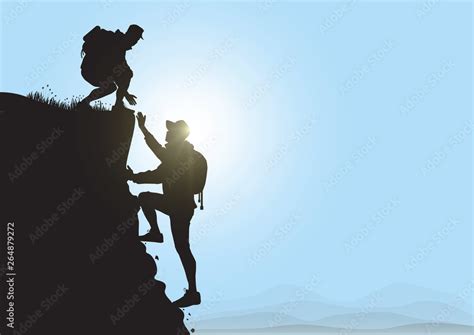 Silhouette Of Two People Hiking Climbing Mountain And Helping Each