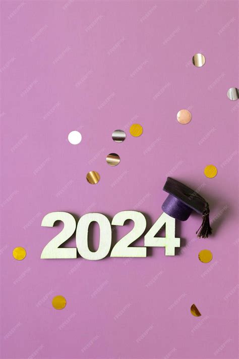 Premium Photo Wooden Number 2024 With Graduated Cap And Tinsels Class Of 2024 Concept