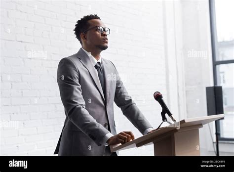 Young african man speech podium hi-res stock photography and images - Alamy