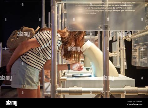 Young Scientist In Action Girl Engrossed In Microscope Exploration At