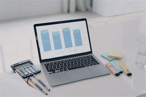 Premium Photo Laptop Screen With Bars Of Graphs On Display Data