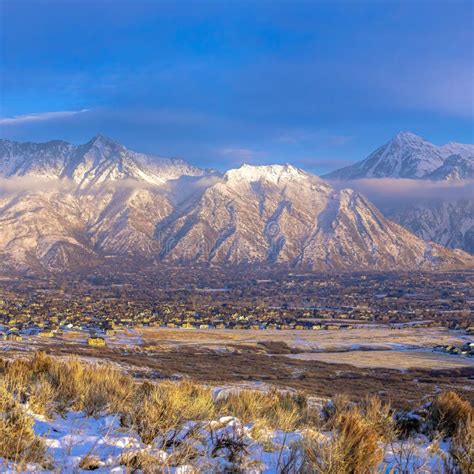 Square Panoramic View Of Mount Timpanogos And Residences Blanketed With Snow In Winter Stock
