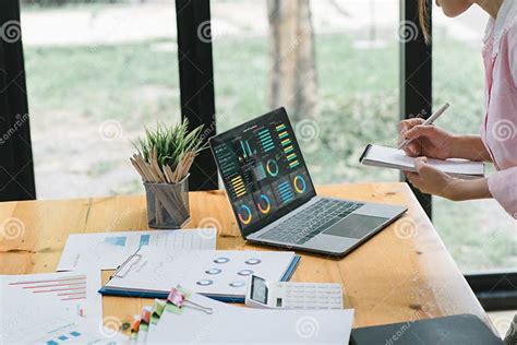 The Female Analyst Utilizes A Computer And A Dashboard For Business Data Analyze And A Data