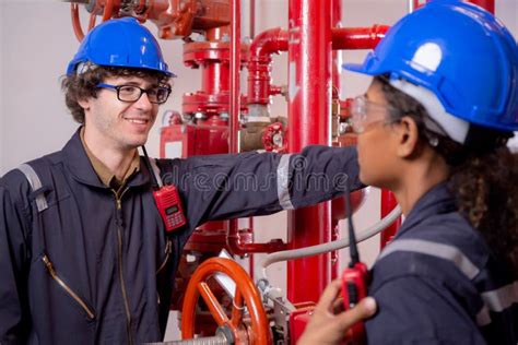 Young Woman And Man Engineer Check And Examining Pipeline And