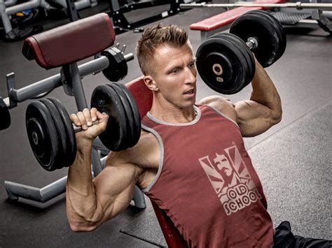 How To Do A Military Press Standing Vs Dumbbell Vs Seated Vs